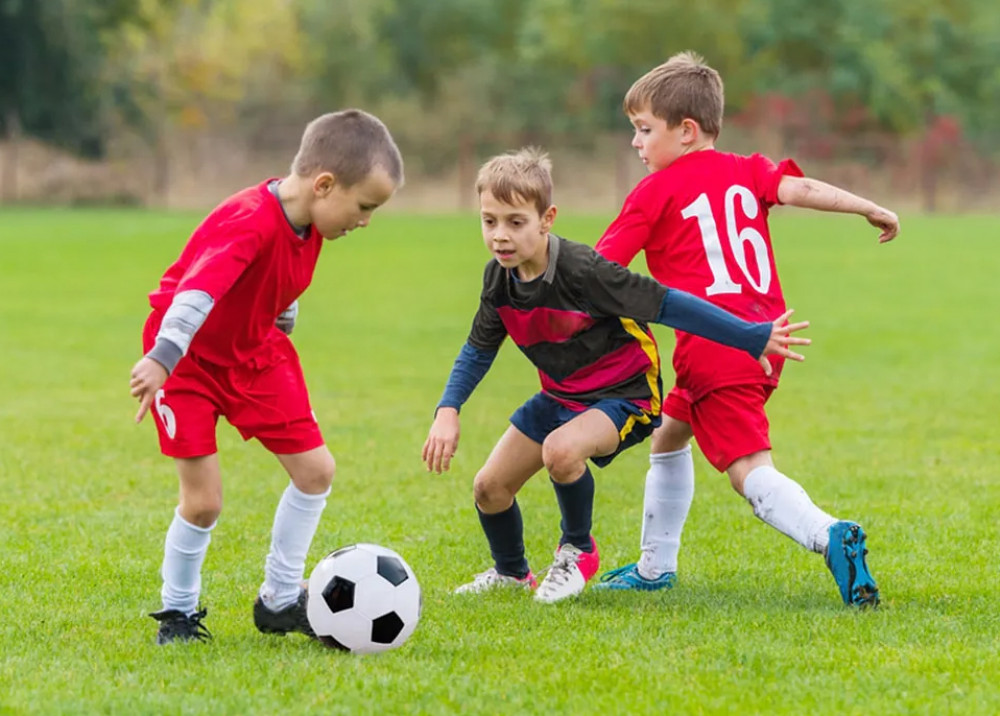 Emphasize the importance of teamwork for football | Fit Box Center